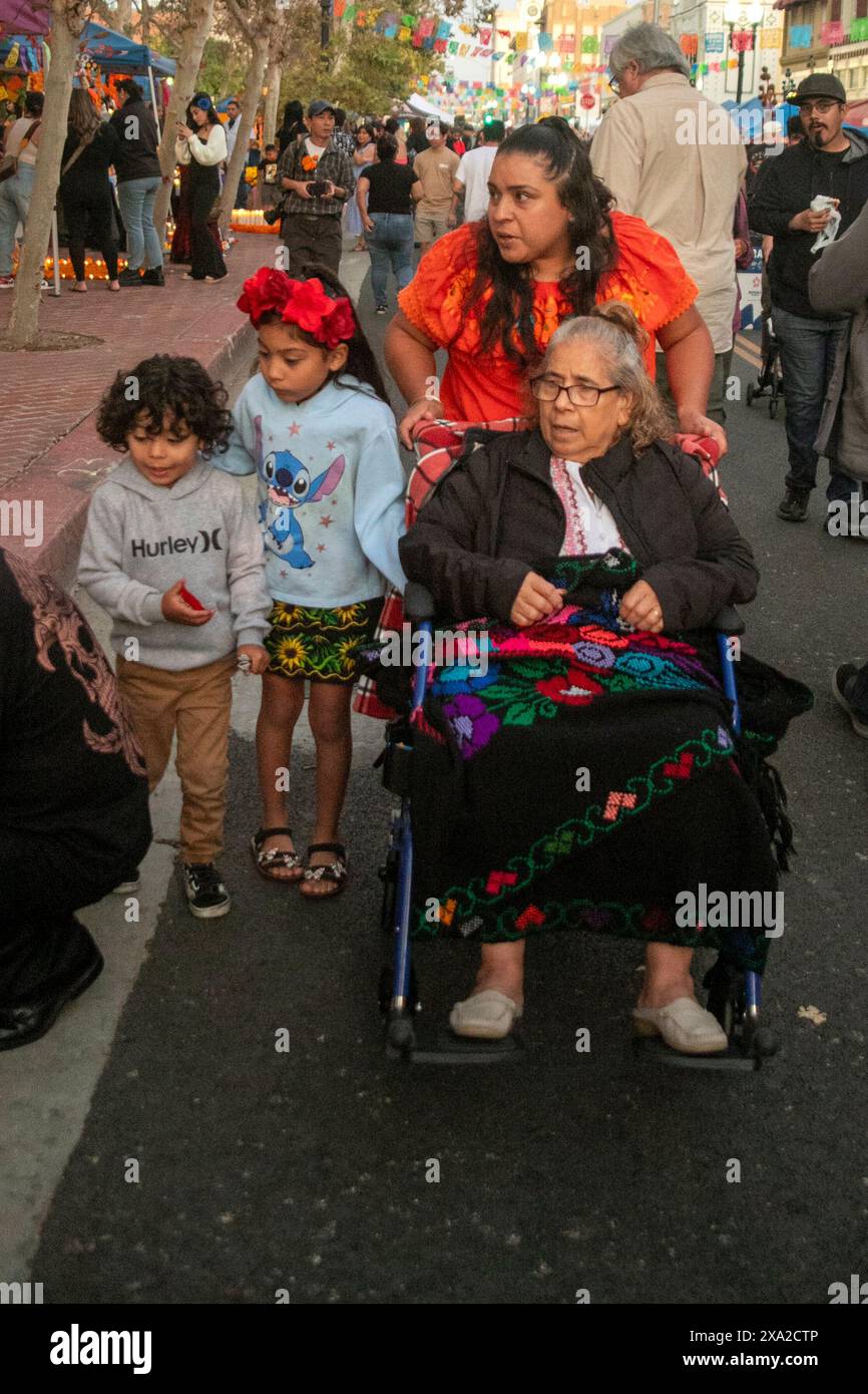 Three generations of a Mexican American family visit a Day of the Dead ...