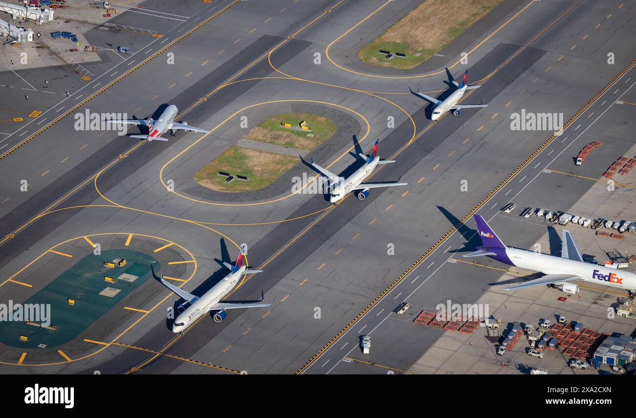 An aerial view of an American Airlines jet taxiing past Delta Airlines ...
