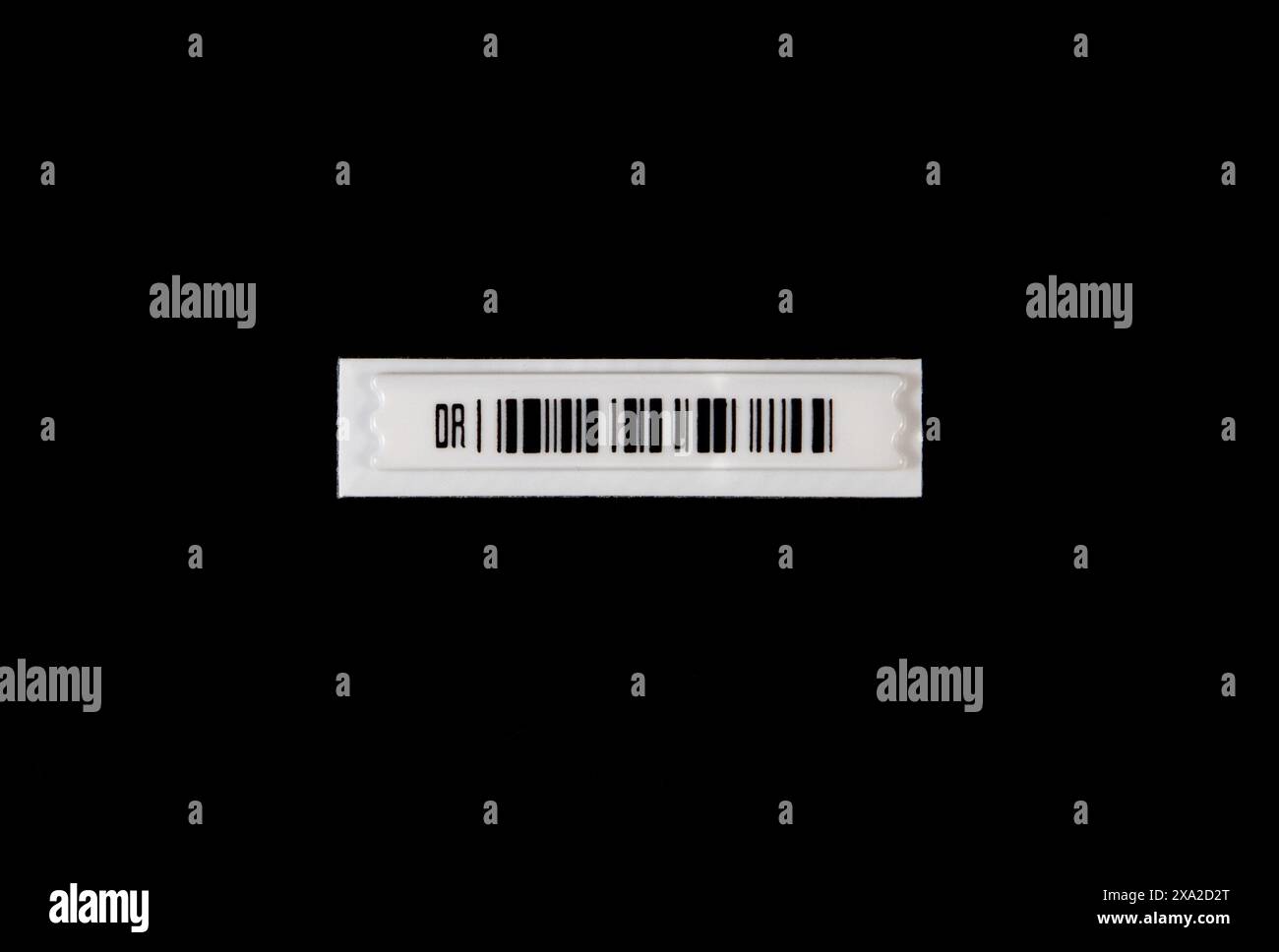Anti-theft magnetic barcode label on black backdrop Stock Photo - Alamy