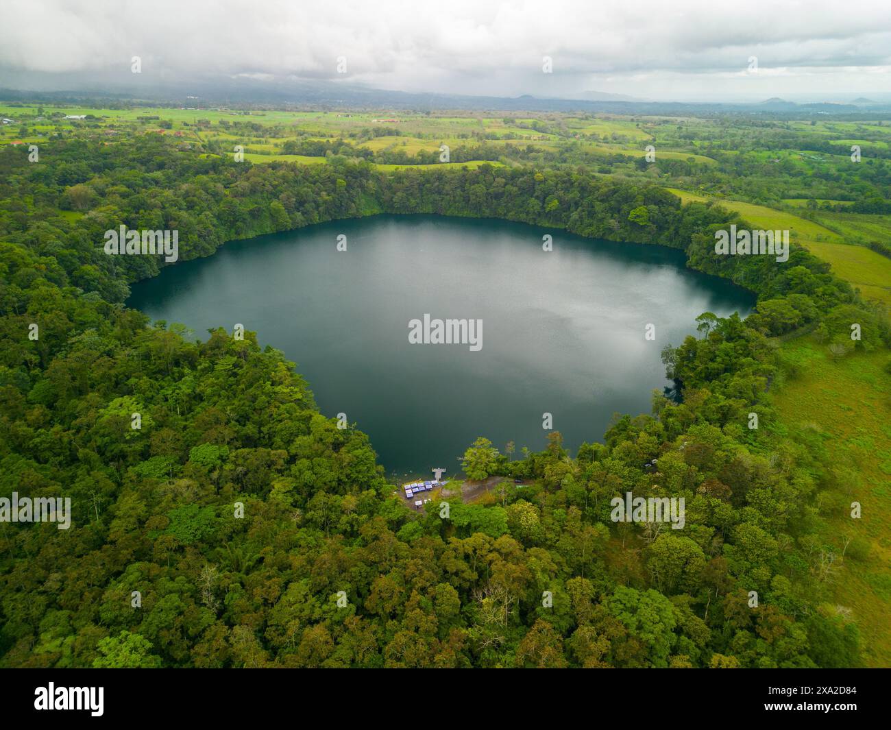 An aerial view of Rio Cuarto lake in Alajuela, Costa Rica, surrounded ...