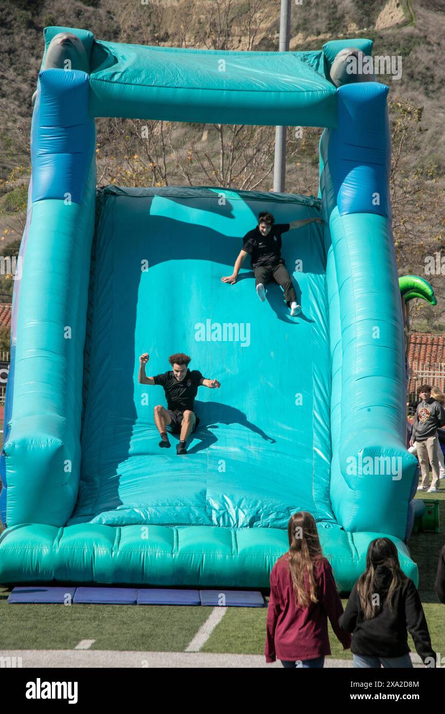 Multiracial Southern California high school students enjoy a bounce ...