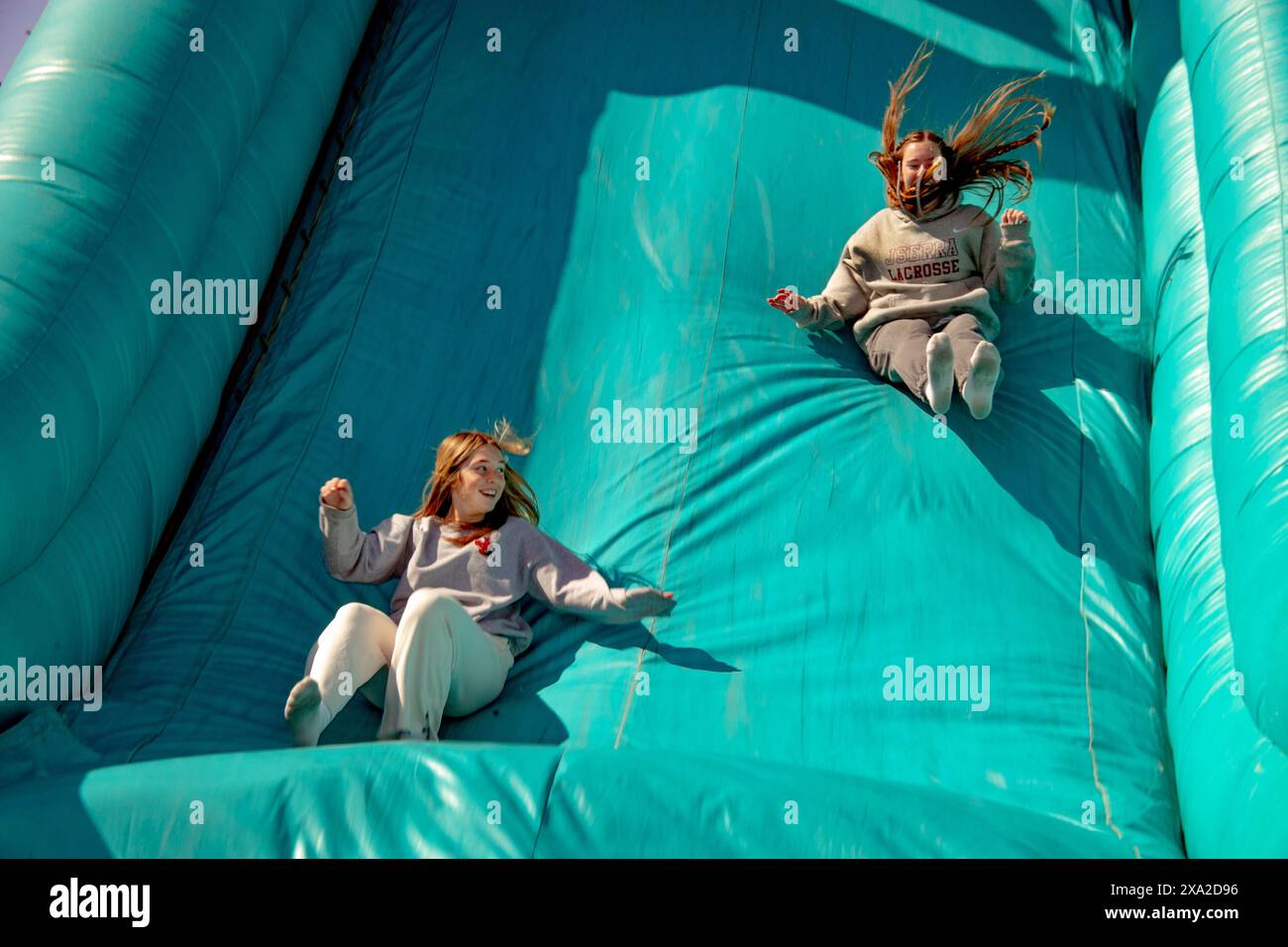 Multiracial Southern California high school students enjoy a bounce ...