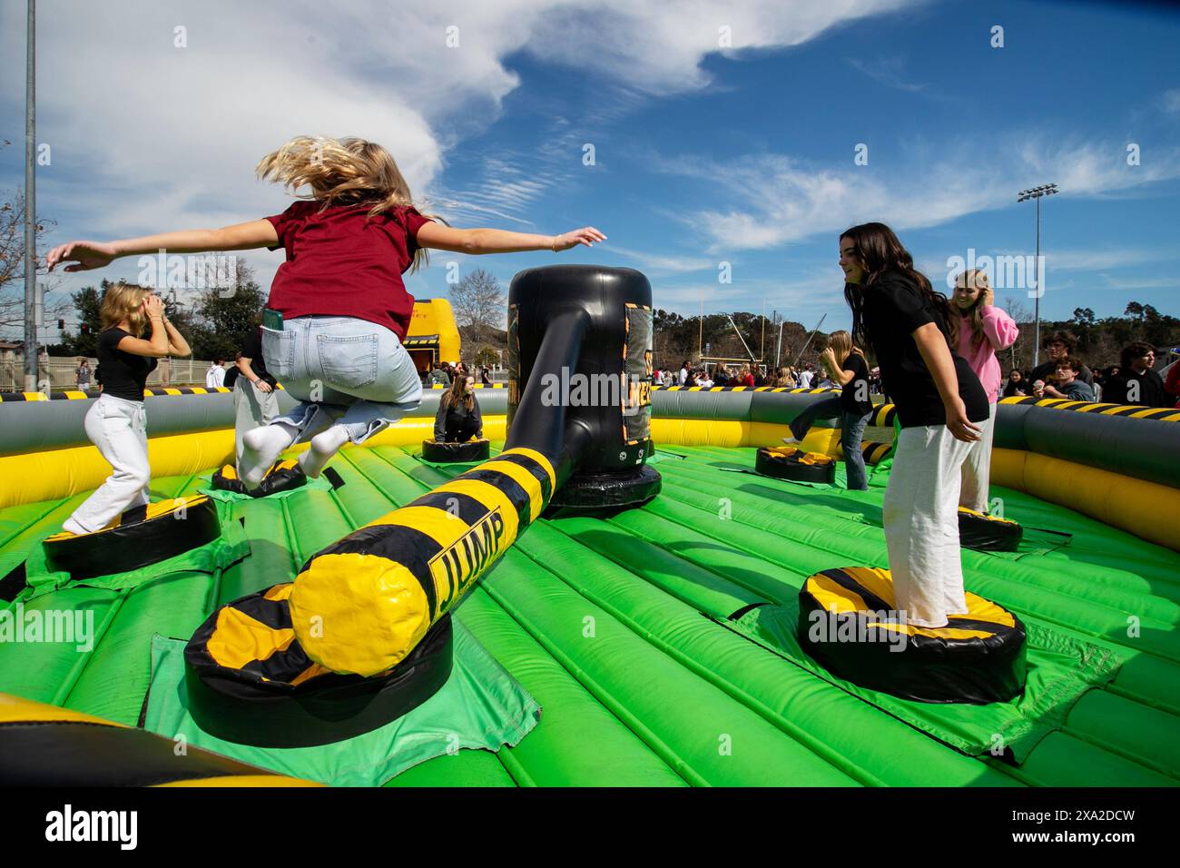 Southern California high school students jump over barriers on a ride ...