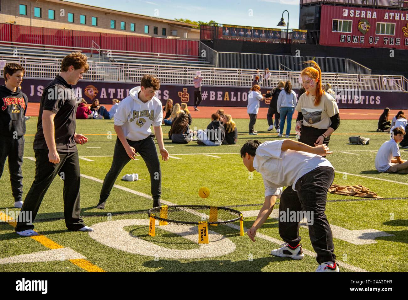 Students at a Southern California Catholic high school play spike ball ...