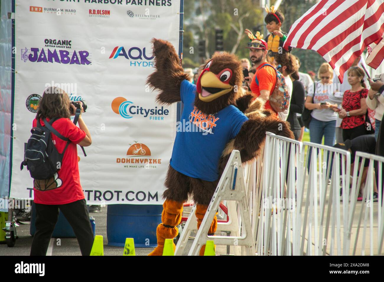 An entertainer in a turkey costume poses for a photographer during a ...