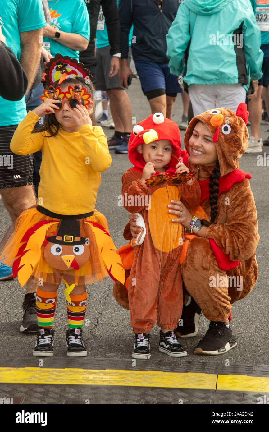 Mother and children at a Thanksgiving Day "Turkey Trot" foot race ...