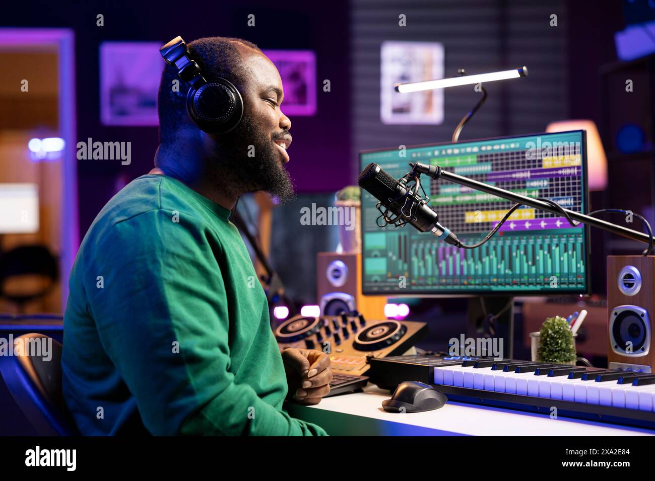Sound engineer adjusting levels on hi-res stock photography and images ...