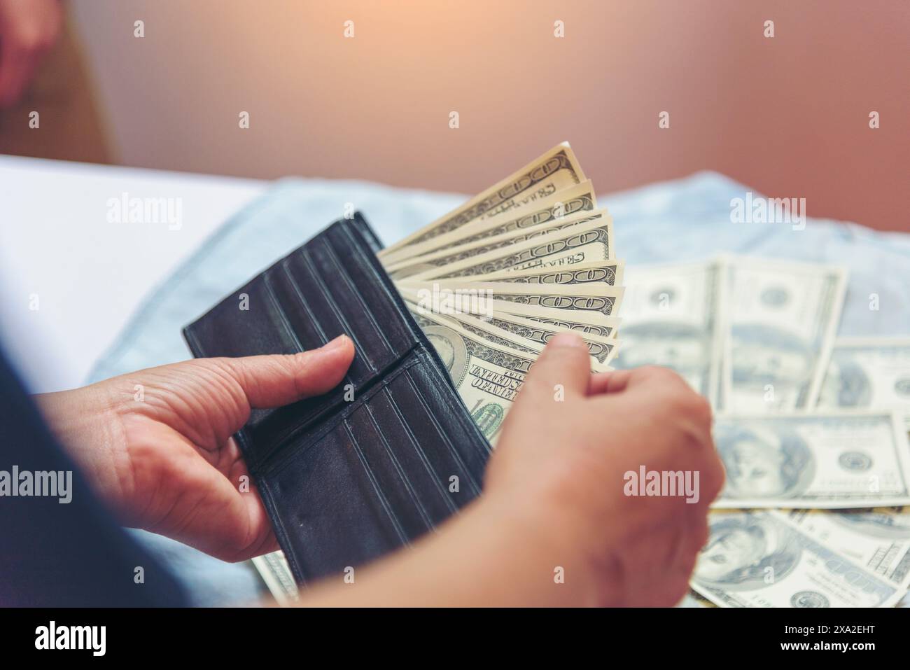 Hand holding money dollar bank note in wallet give financial payment ...