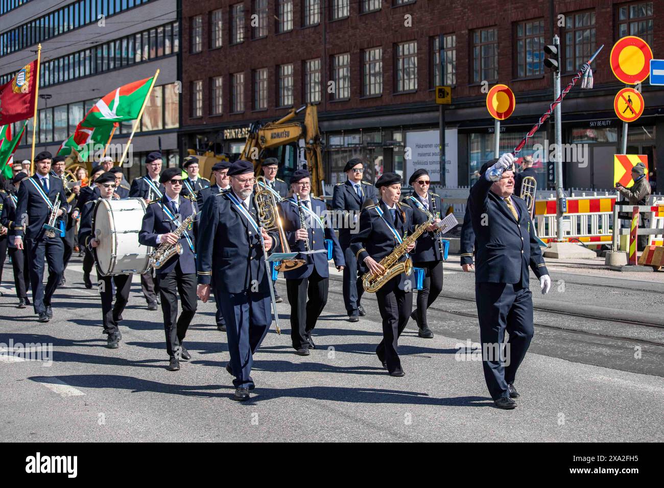 Marching band leading Labor Day march on Siltasaarenkatu in Hakaniemi ...