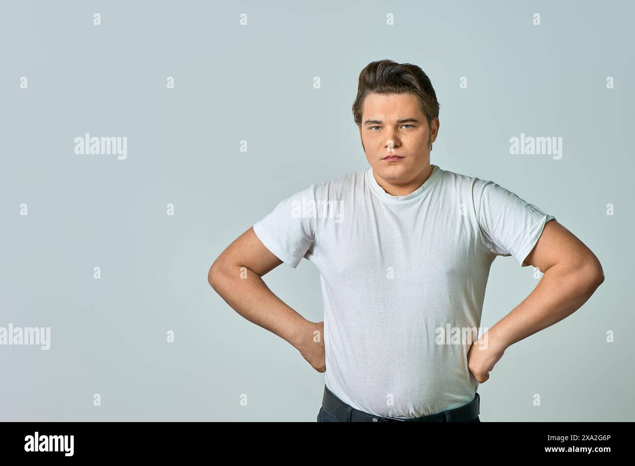 Angry, frowning man on a gray background, copy space Stock Photo - Alamy