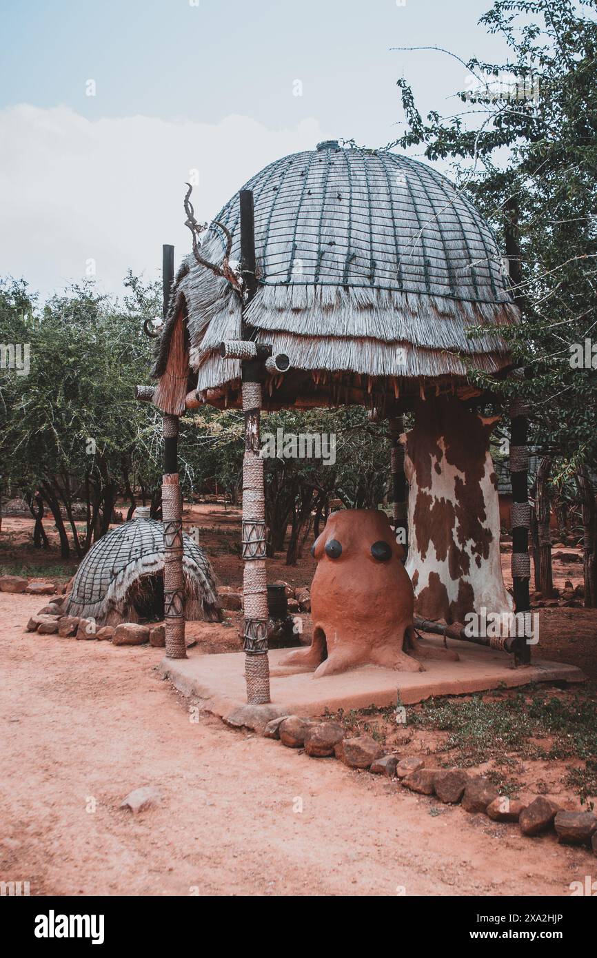 This captivating photograph showcases rustic tribal huts in a ...