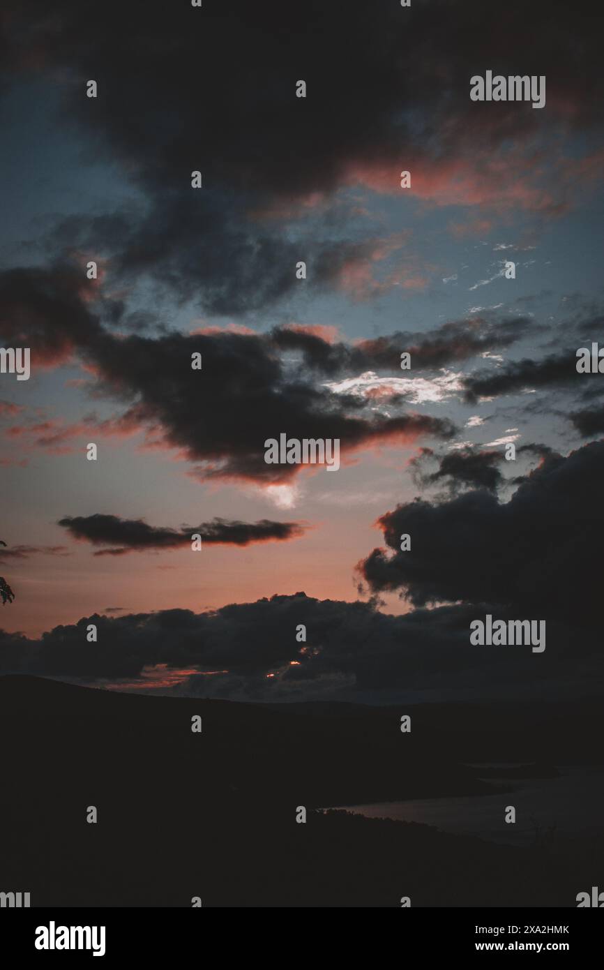 A mesmerizing dusky sky with deep hues of red and blue over the African ...