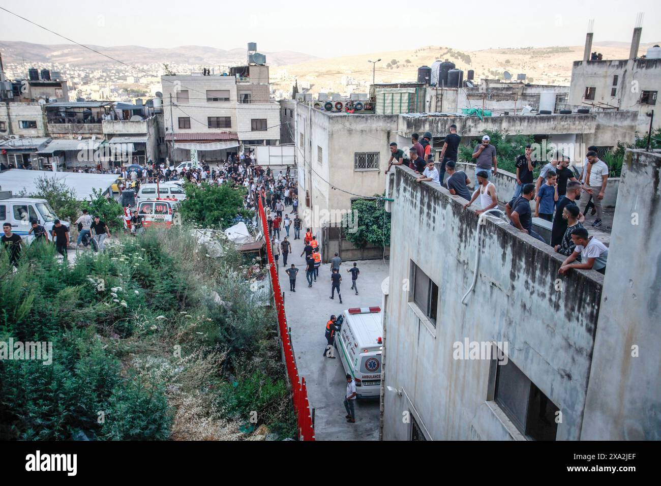 Nablus, Palestine. 03rd June, 2024. People gather around the site ...