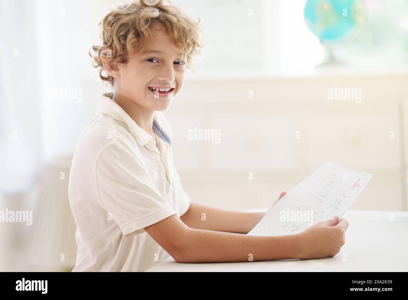 Student happy with exam paper classroom hi-res stock photography and ...