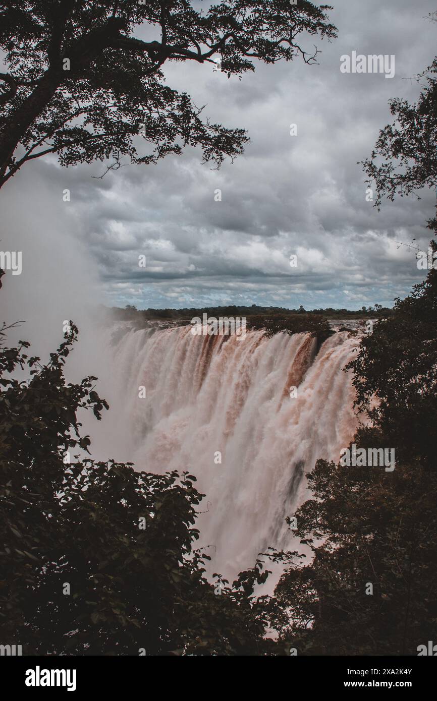 A breathtaking capture of the thundering Victoria Falls surrounded by ...
