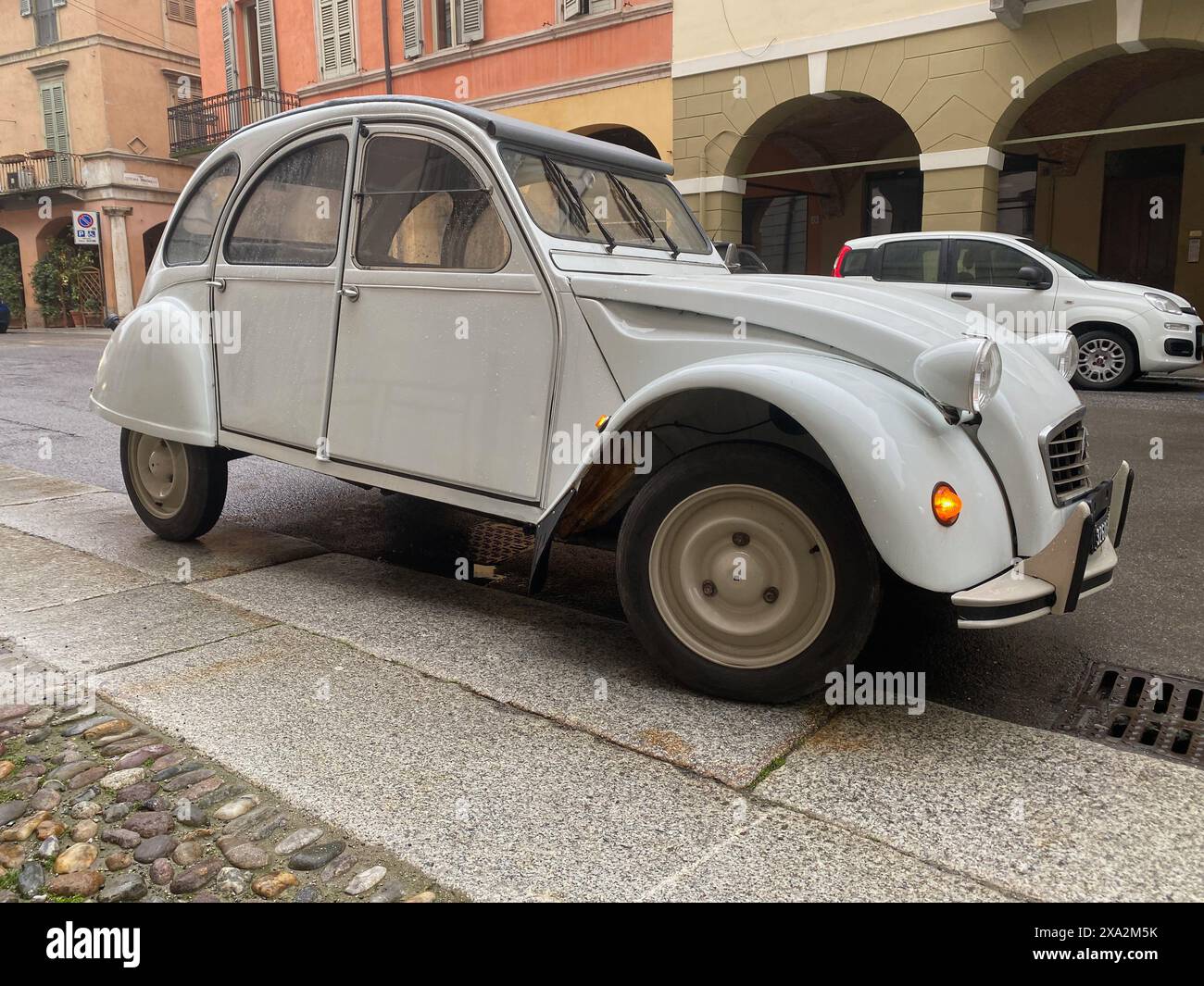 Lombardy, Italy - May 2nd 2024 Classic white citroen 2cv parked on a ...