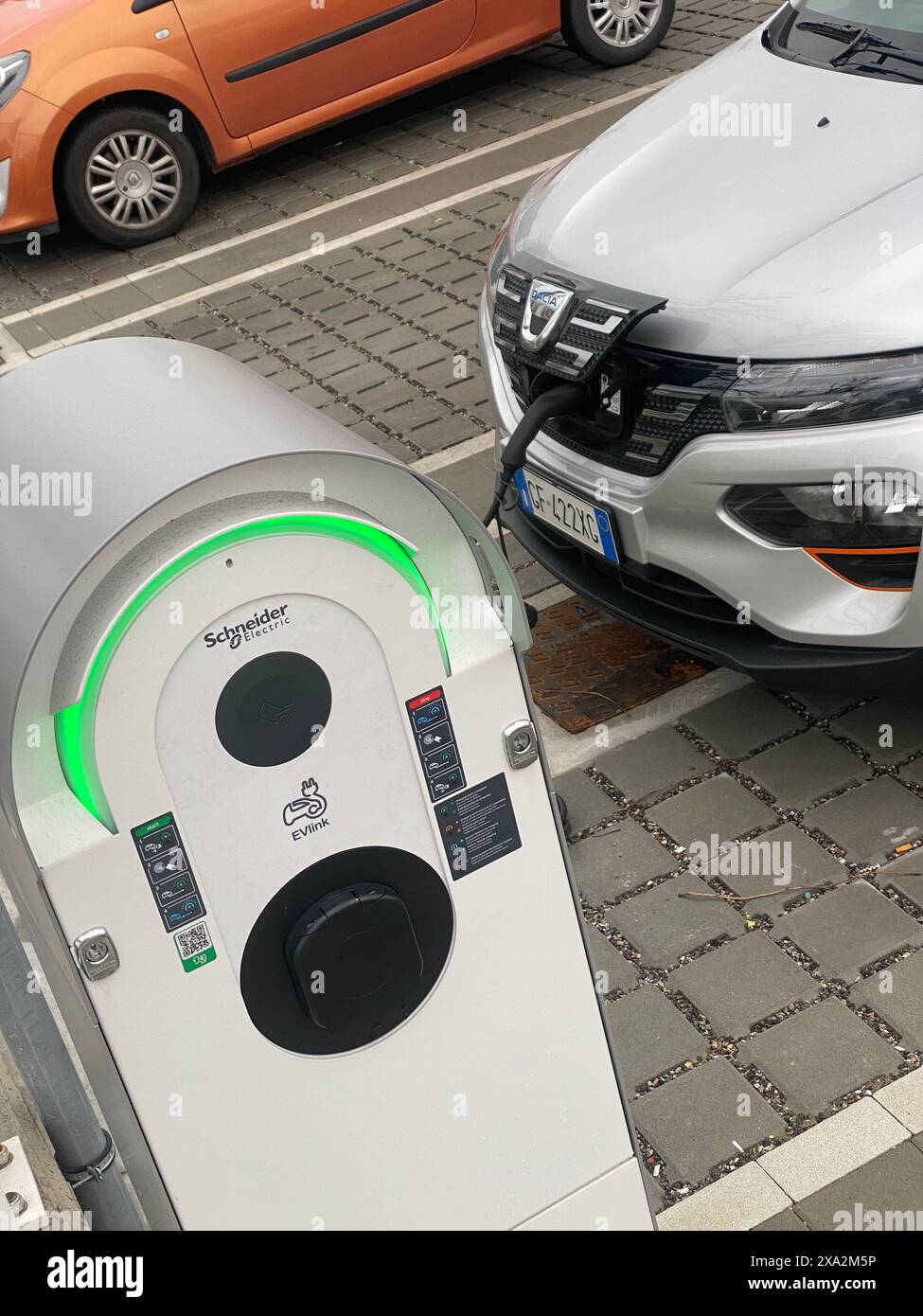 Piacenzam Italy - May 2nd 2024 Modern electric car attached to ev ...