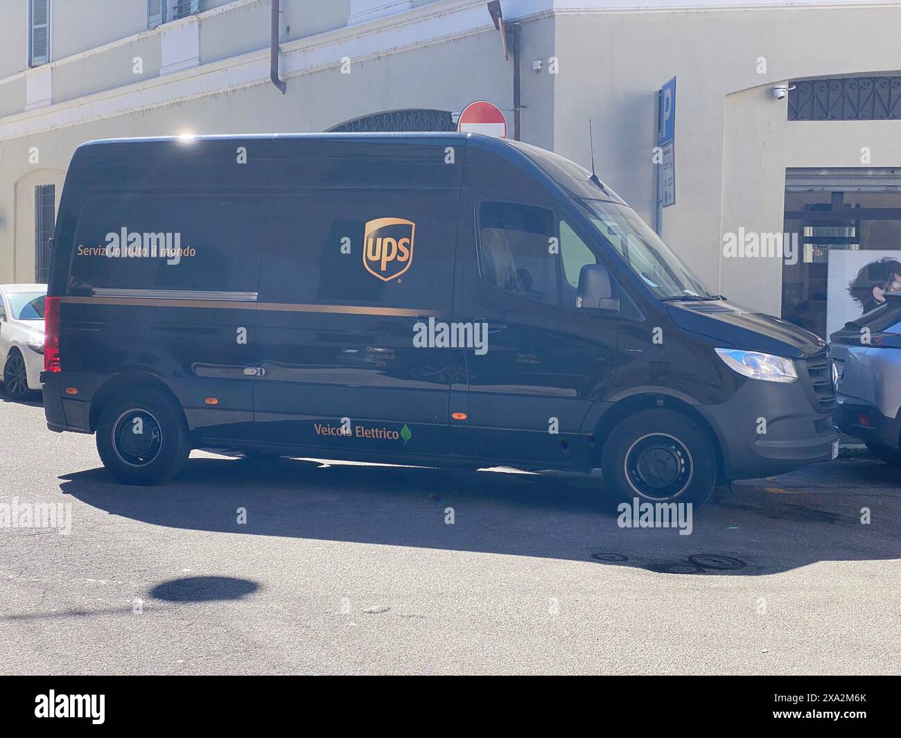 Cremona, Italy - May 2nd 2024 Brown ups electric delivery van parked on ...
