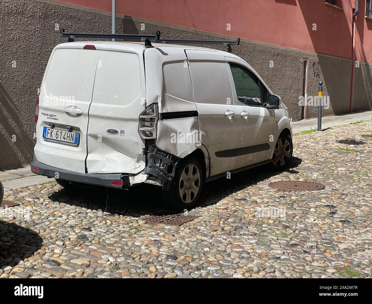 Cremona, Italy - May 2nd 2024 The back of a white work van, heavily ...