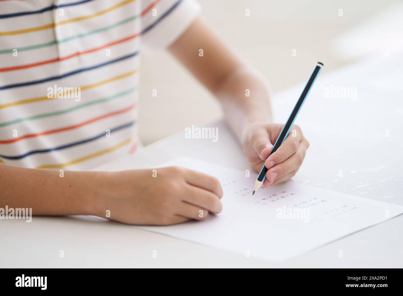 Child in school. Student in class. Boy doing homework. Homeschooling or ...