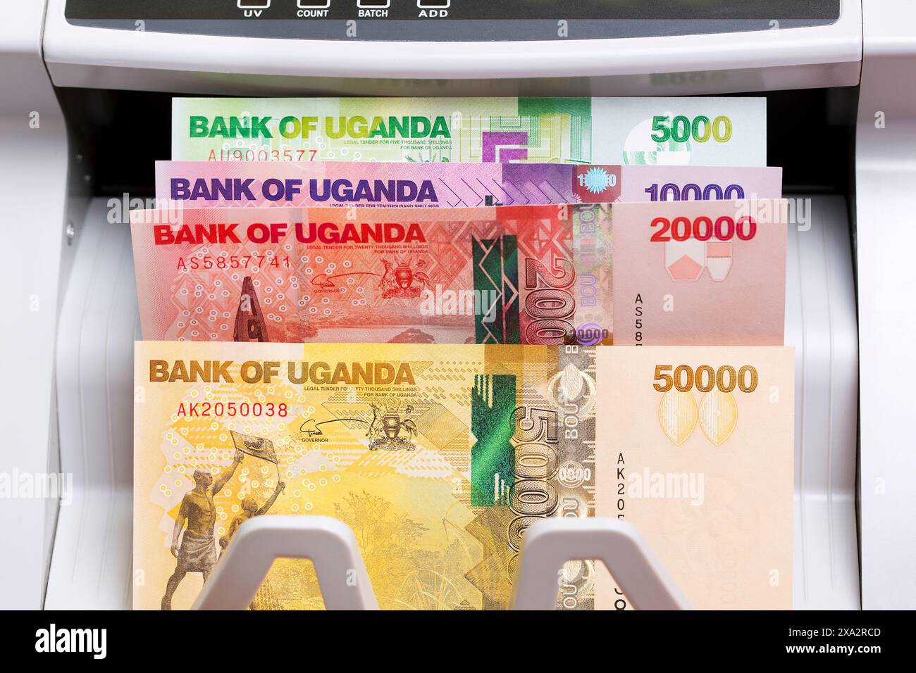 Ugandan money - shilling in a counting machine Stock Photo - Alamy