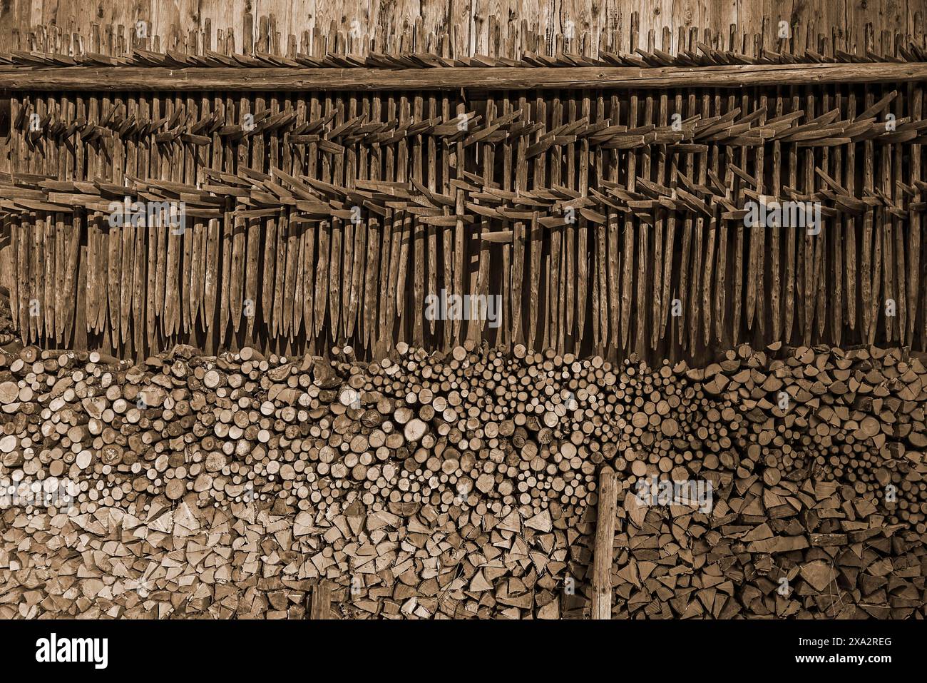Stacked firewood and hanging hay, hay dryer at a barn, Bad Oberdorf ...