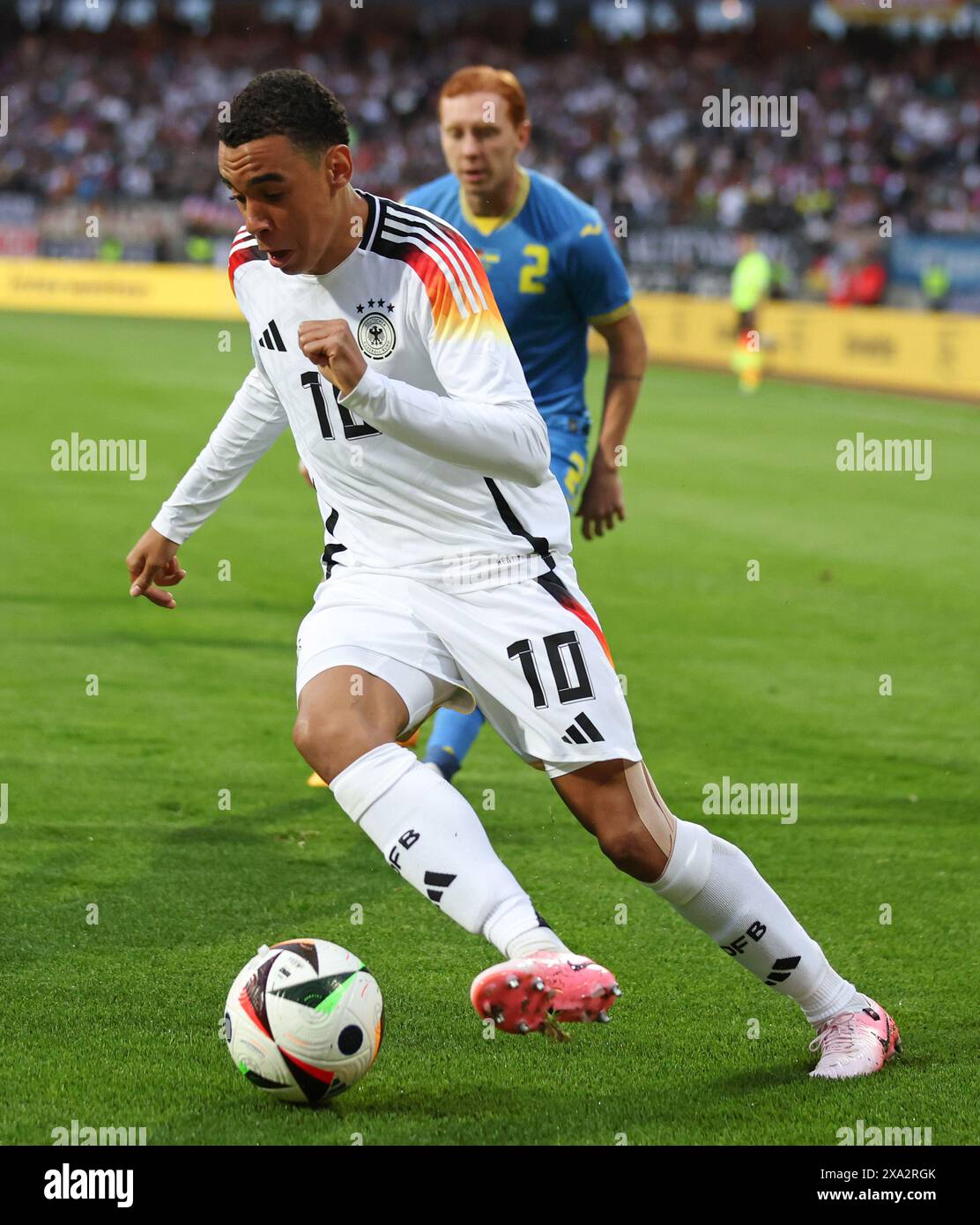 NUREMBERG, GERMANY - JUNE 03: Jamal Musiala of Germany runs with a ball ...