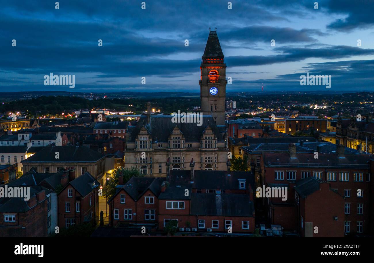 The clock tower on Wakefield Town Hall is lit up in the colours of the ...