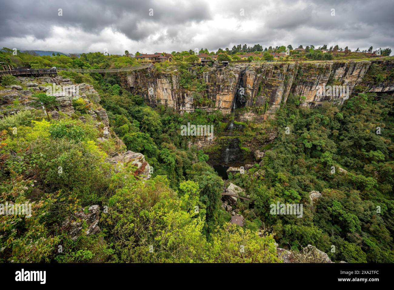 Suspension bridge and Motitsi Falls in the Graskop Gorge or ...