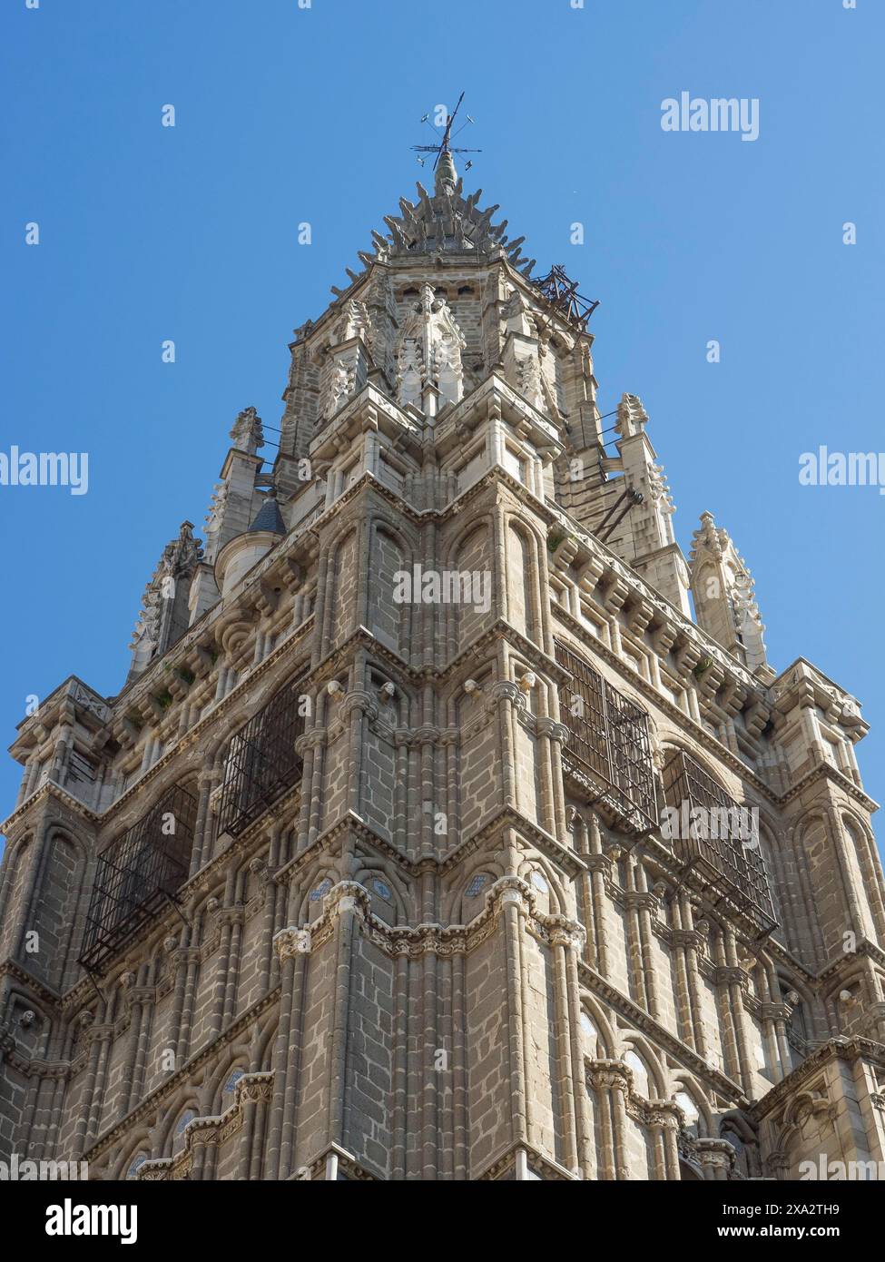 Architectural details of gothic towers and stone walls under a clear ...