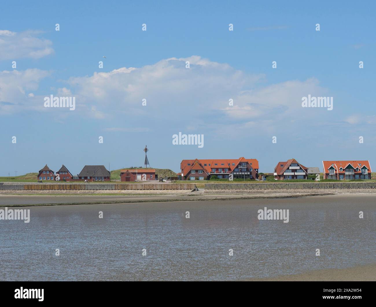 Coastal landscape with modern and traditional houses along the coast ...