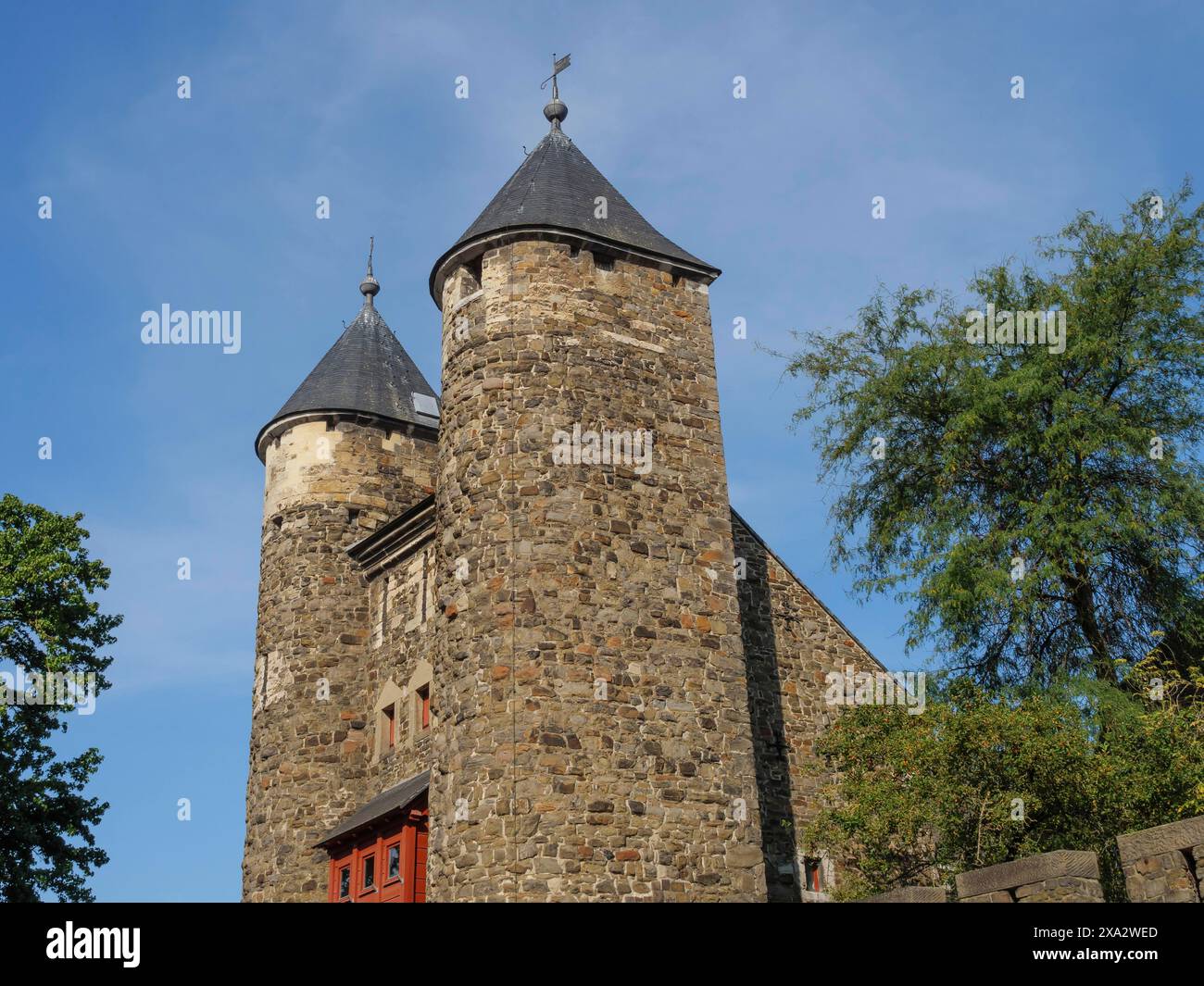 Two impressive stone towers of a historic castle under a clear sky ...