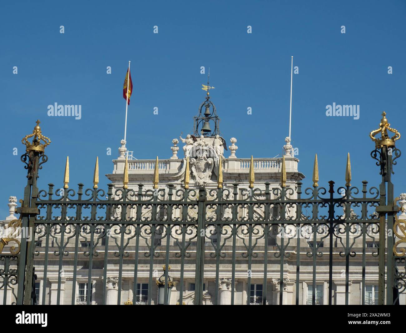 A historic fence with lace and ornate decorations in front of a ...