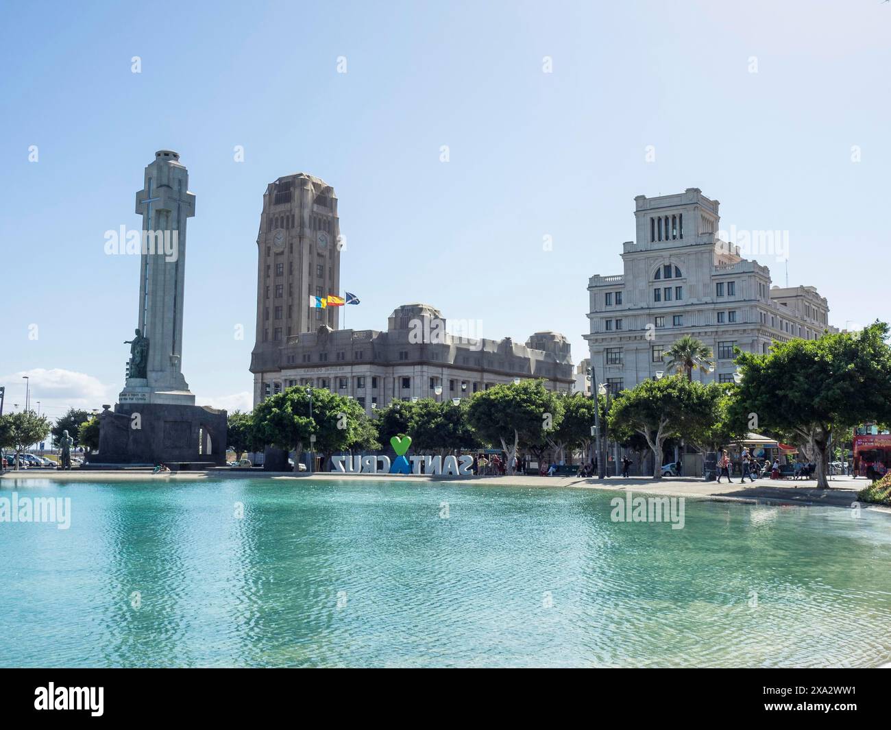 Historic buildings and monuments surround a town square with fountains ...