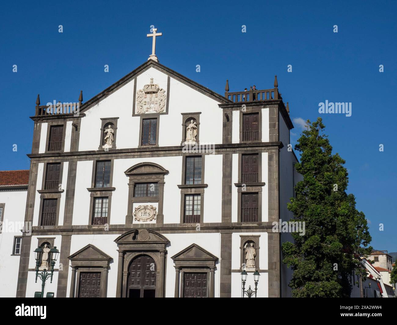Historic church with white and brown facades, religious ornaments ...