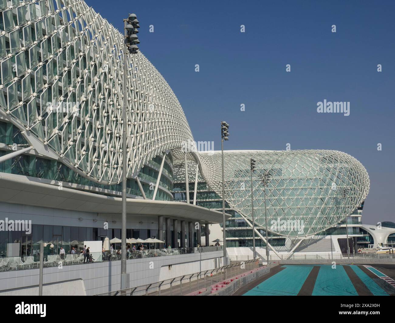 Building with modern grid structure, large windows and racetrack under ...