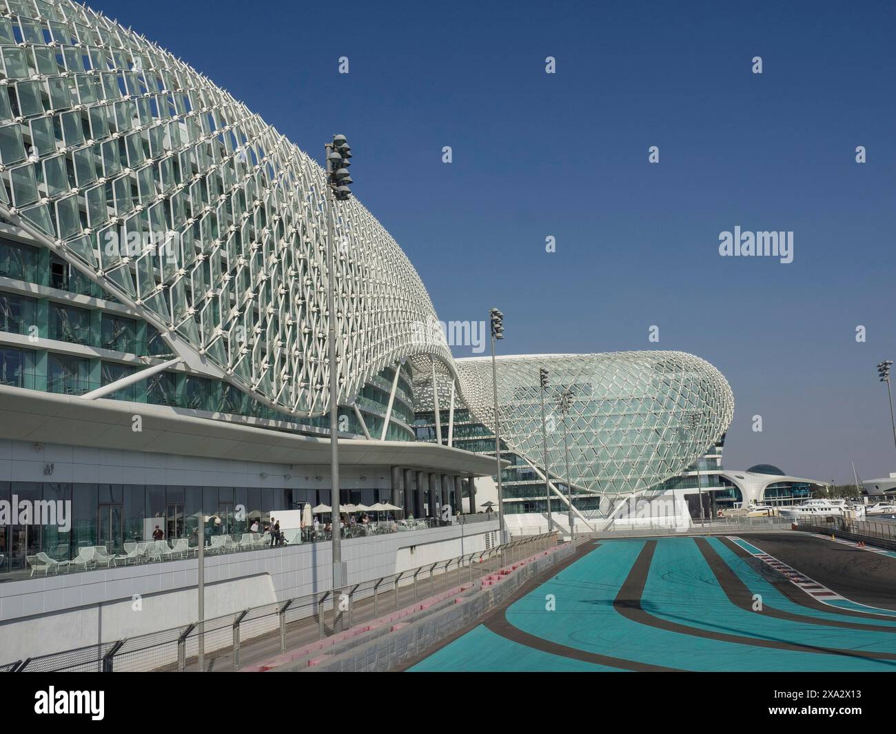 Modern building with striking grid structure and adjacent race track ...