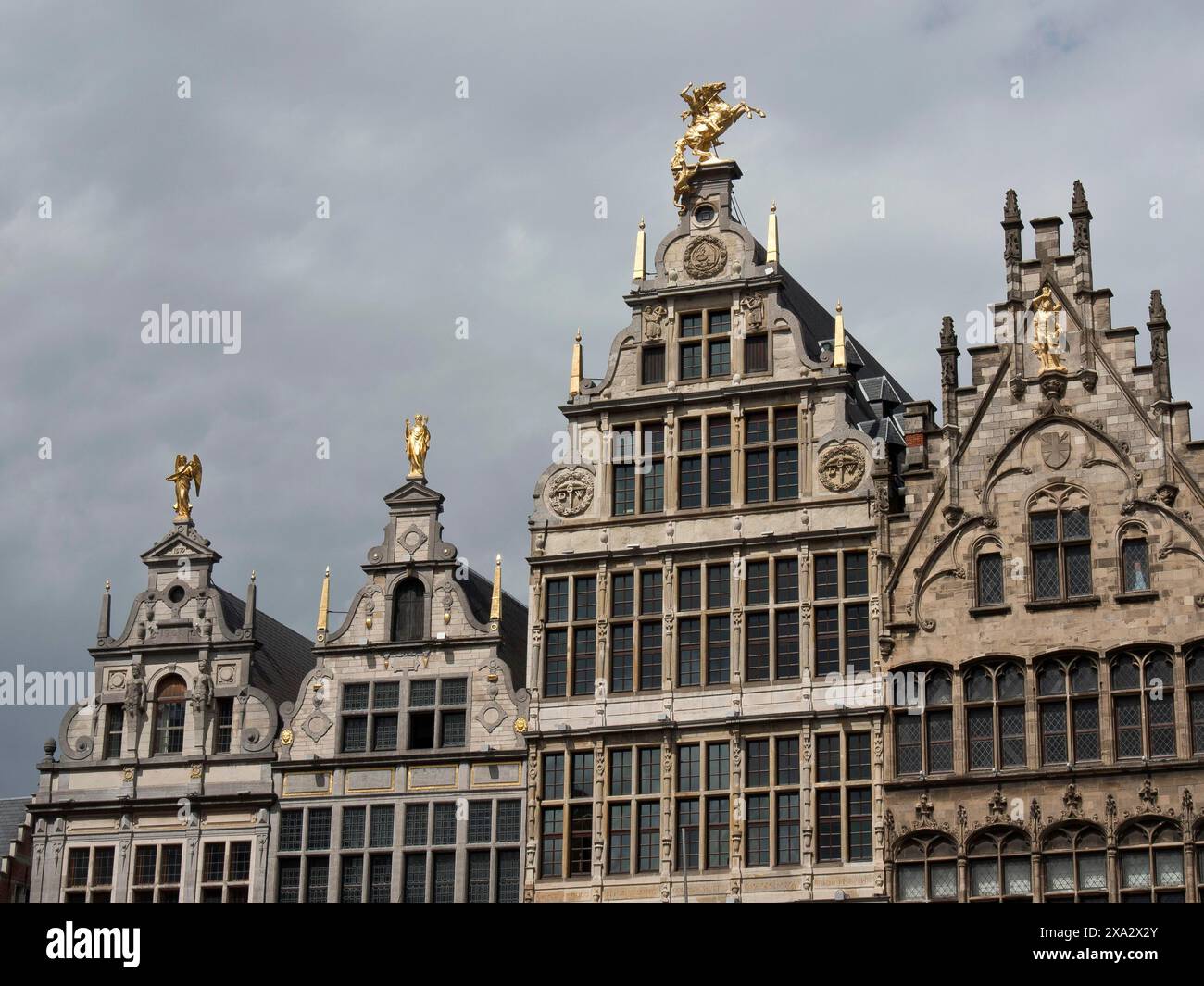 Historic buildings with magnificent facades and statues under a cloudy ...