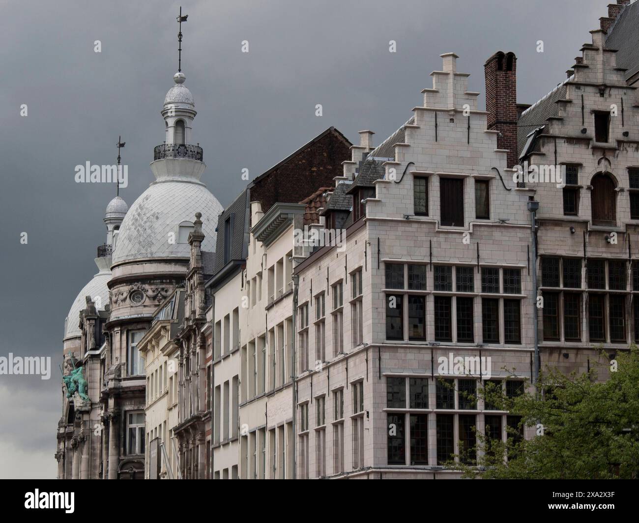 Row of old buildings under a cloudy sky, creating a gloomy atmosphere ...