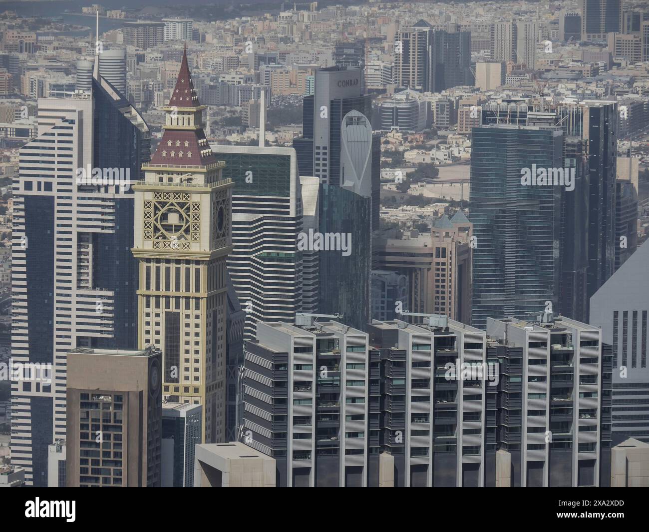 City view with modern skyscrapers and a striking clock tower amidst ...