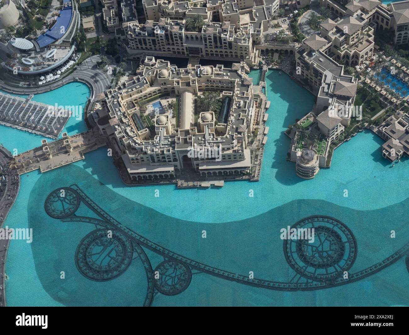 A luxurious hotel resort with large swimming pools and modern buildings ...