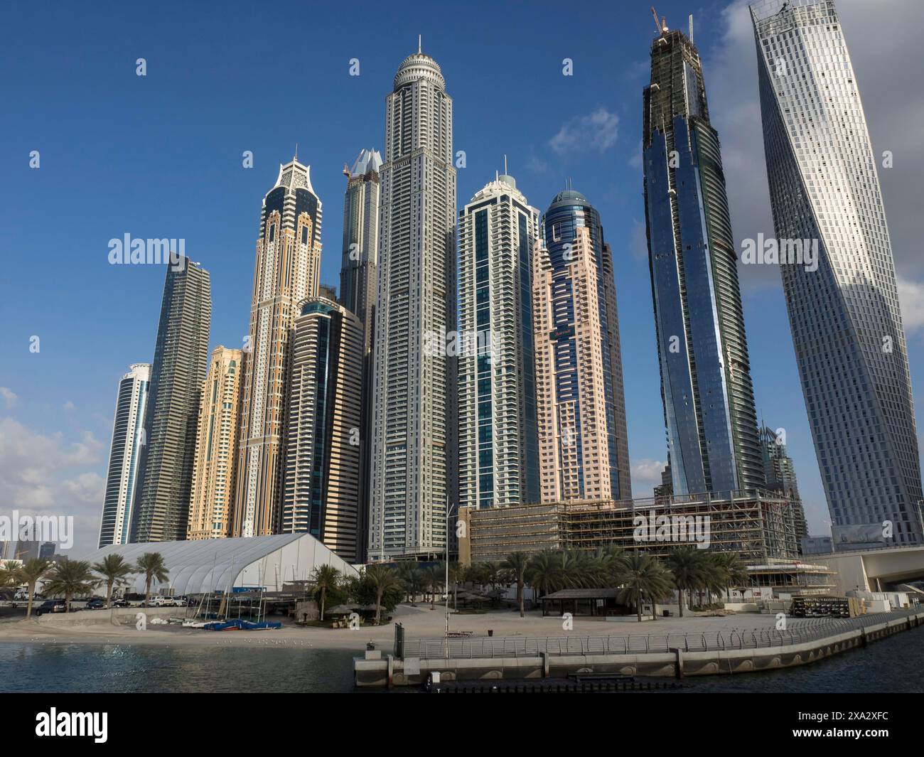 Wide angle view of a dense skyline of modern skyscrapers in sunny ...