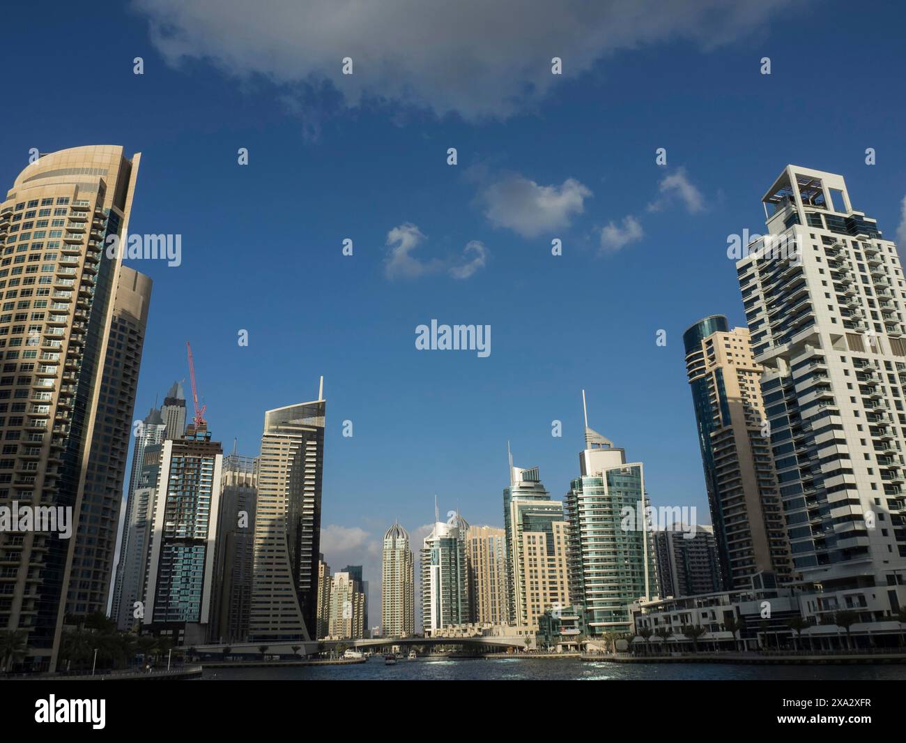 Modern skyline of Dubai with various skyscrapers and blue sky, dubai ...