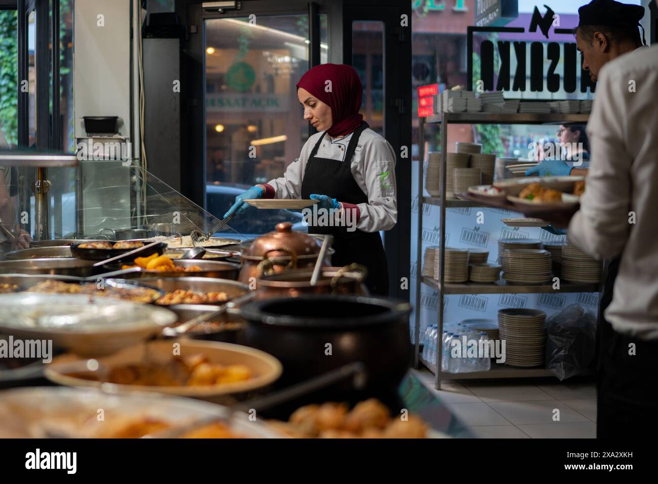 May 31, 2024, Afyonkarahisar, Turkey: A woman prepares the food of the ...