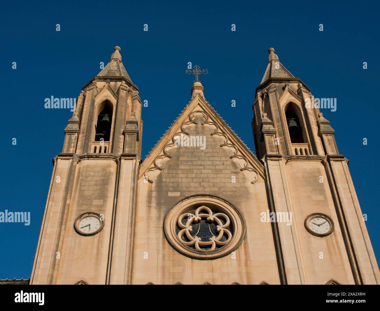 Close-up of a Gothic church with two towers and symmetrical stone ...