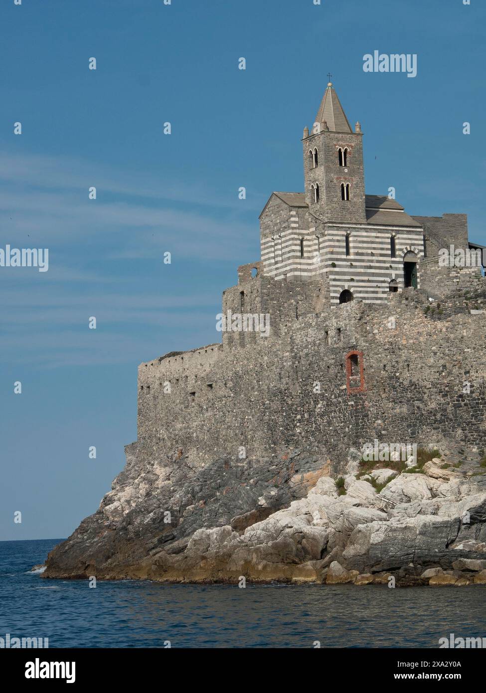 A historic church on the cliffs by the sea with impressive stone ...