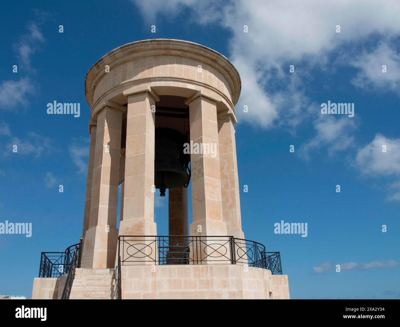 A classic turret rises under a bright, cloudy sky, Valetta, Malta Stock ...