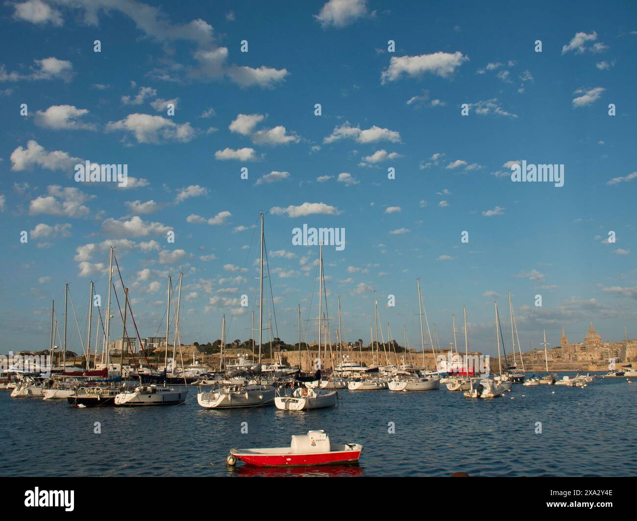 Crowded harbour with yachts and sailboats under a cloudy sky, Valetta ...