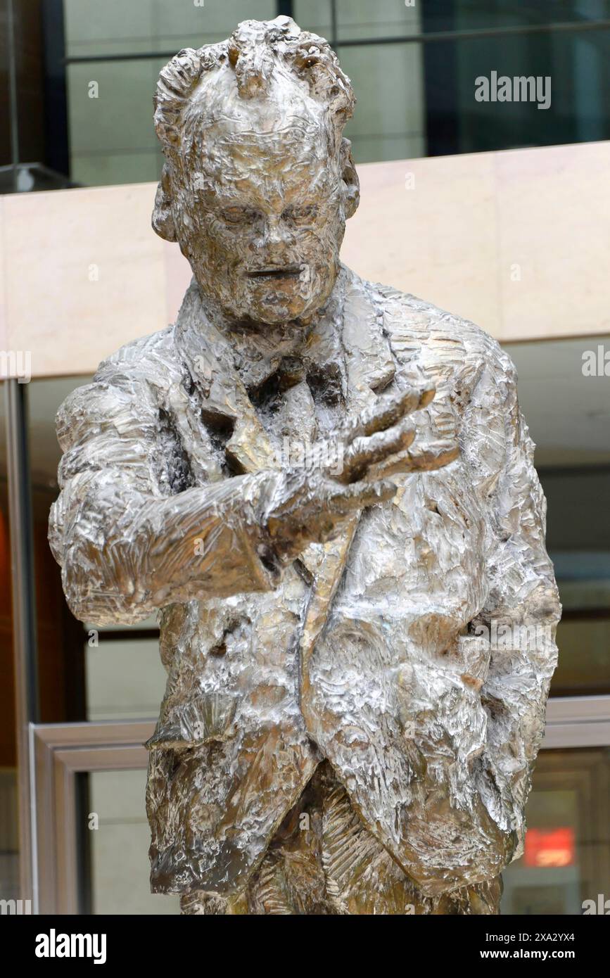 A bronze sculpture of a man in modern style, detailed view of a face ...