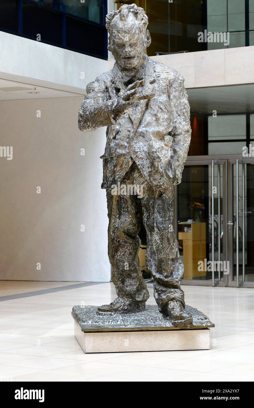 Bronze statue of a man in a modern lobby of a building, Willy-Brandt ...
